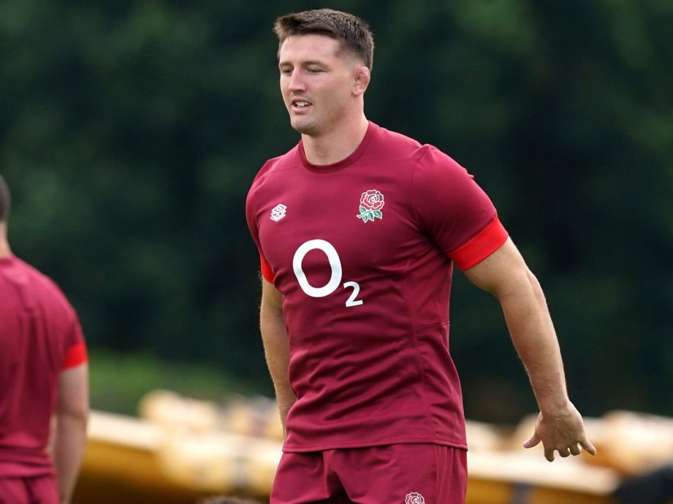 England flanker Tom Curry in a protective boot after suffering ankle ...